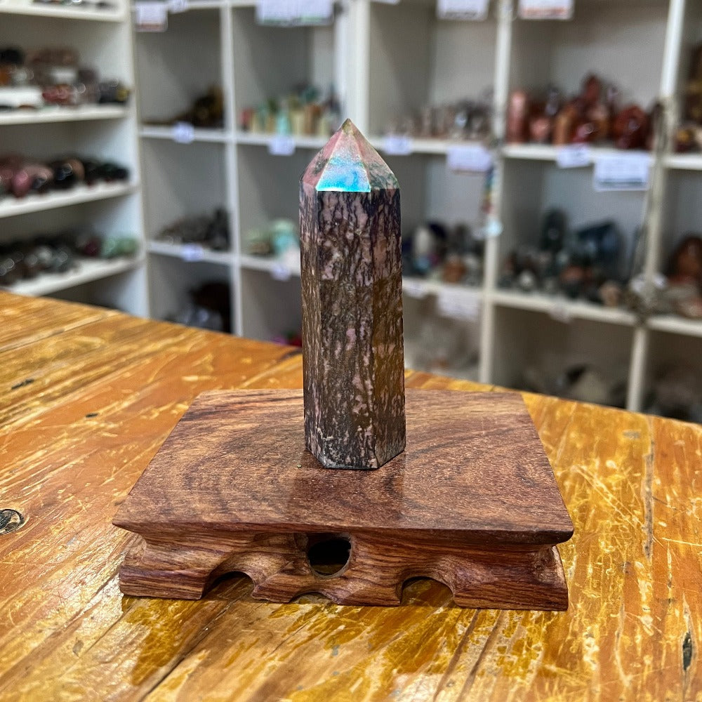 Aura Rhodonite Point – Crystals by Sisters