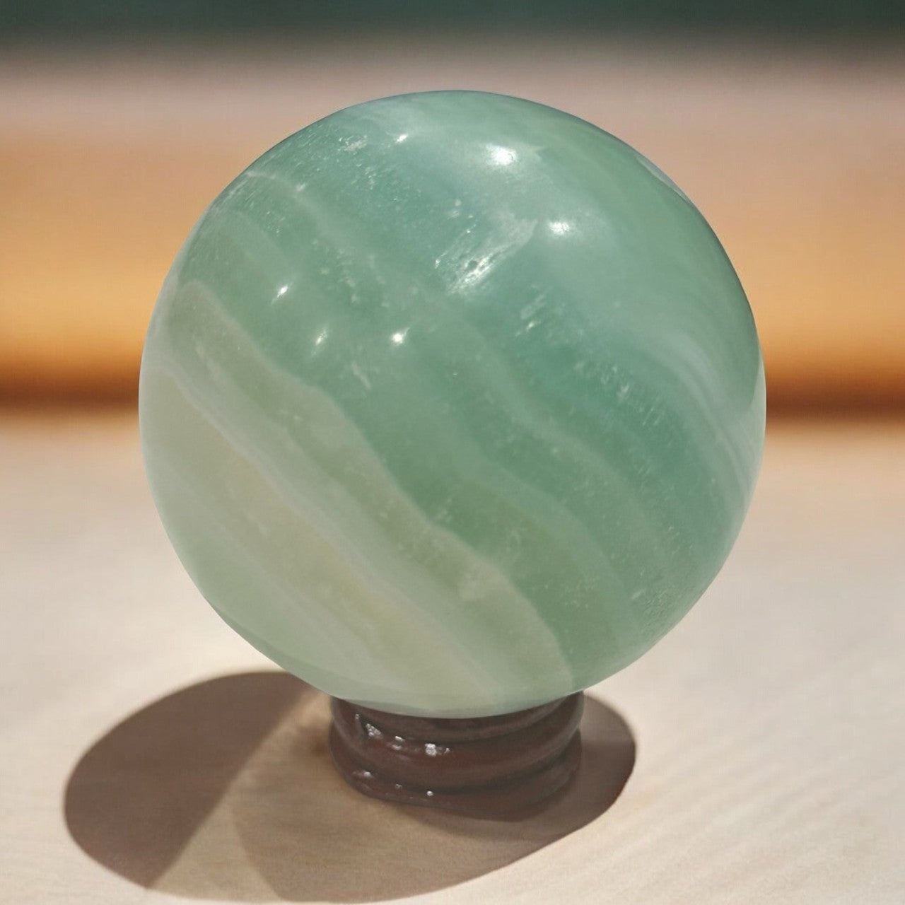 Pistachio Calcite Sphere | 447g – Crystals by Sisters